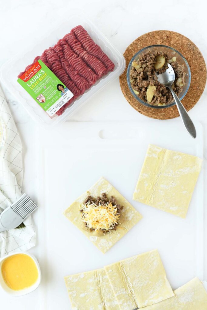 Easy Cheesy Beef, Onion, & Potato Puff Pastry Pockets - Sizzling Eats